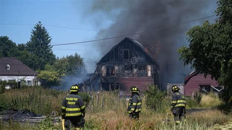 House Fire Aftermath Firefighters Survey Scene Of Devastation Smoke