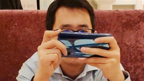 Mi Allegedly Spotted In The Hands Of A Xiaomi Executive Triple Rear Camera In Display