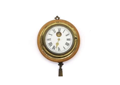 Sold At Auction A Brass Ship Clock