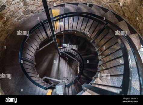 Ascending To The Watchtower A Steel Spiral Staircase Inside A Castles