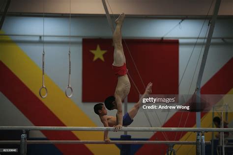 Young Chinese Gymnasts Practice At The Shichahai Sports School On