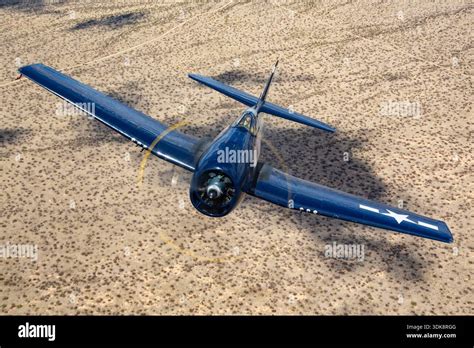 The Image Captures A Grumman F6f 5 Hellcat From A Close Air To Air