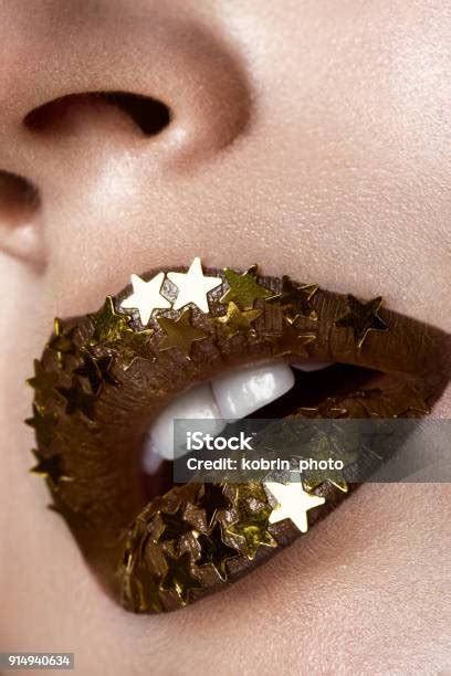Beautiful Girl With Golden Shiny Stars On Her Lips Beauty Face Close Up