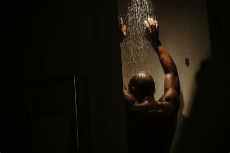Free Photo Handsome African American Man With Naked Torso Takes Shower