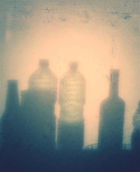 Shadow Of Wine Bottles And Water Bottles Premium Photo