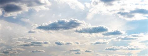 Bright Sky With Small Fluffy Clouds Illuminated By The Sun Stock Image