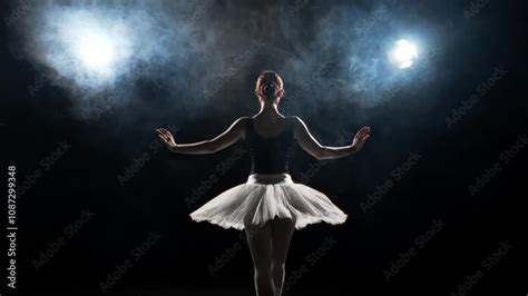 Graceful Female Ballet Dancer Dancing Alone In Dark Hall Silhouette In