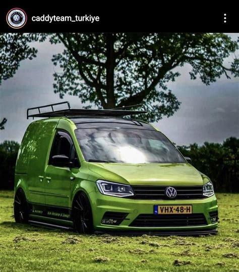 Volkswagen Caddy Van On A Green Field
