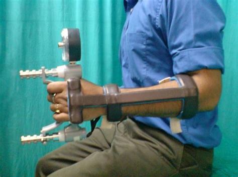 Person Performing Gripping Action On A Jamar® Dynamometer With The Person Performing Gripping Action On A Jamar® Dynamometer With The