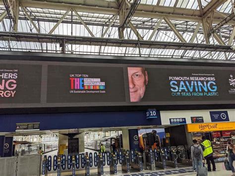 Download Electronic Billboards At Waterloo Station Wallpaper