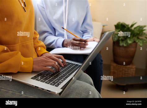 Hands Of Female College Student Coding On Laptop When Her Friend