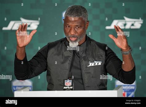New York Jets Head Coach Aaron Glenn Gestures During A Press Conference