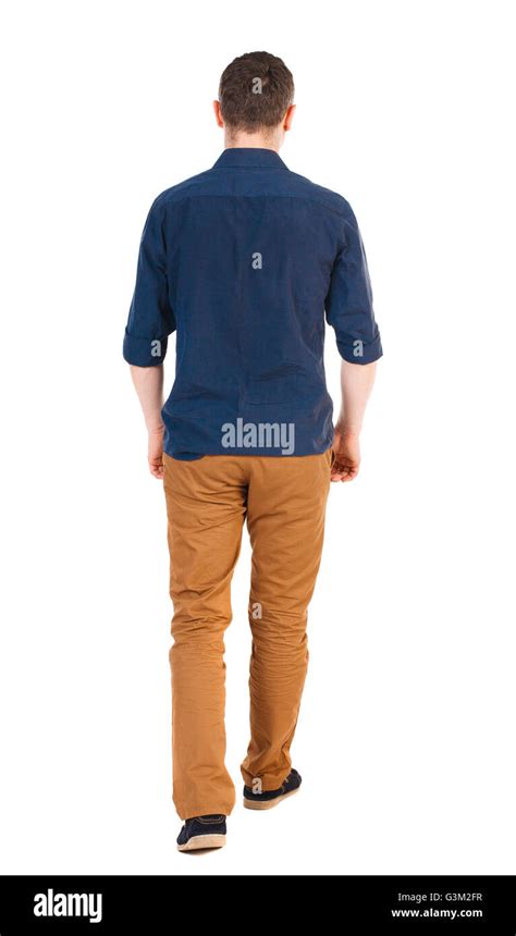 Back View Of Going Handsome Man In Jeans And A Shirt Walking Young Guy