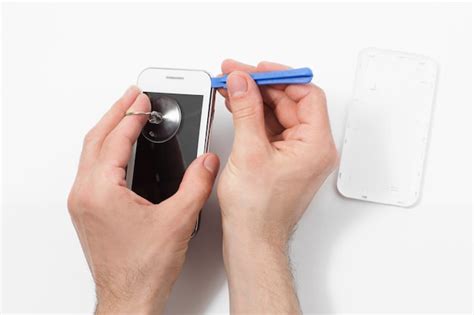 Premium Photo Male Hands Disassembling Smartphone