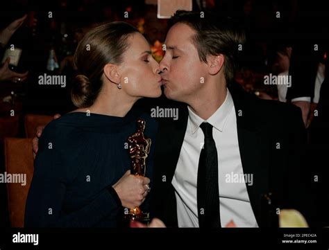 Actress Hilary Swank Kisses Her Husband Chad Lowe As She Holds The Oscar She Won For Best