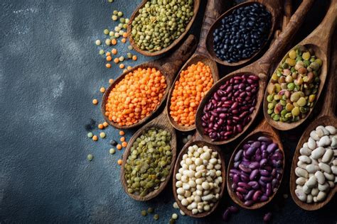 Various Types Of Beans And Lentils In Wooden Spoons 71969043 Stock
