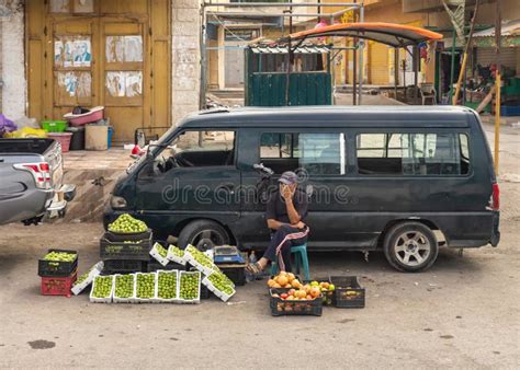 Amman Jordan October 04 2023 A Street Vendor Sits And Sells Fruit