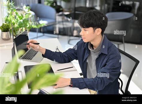 Smart And Professional Young Asian Male Programmer Or Web Developer