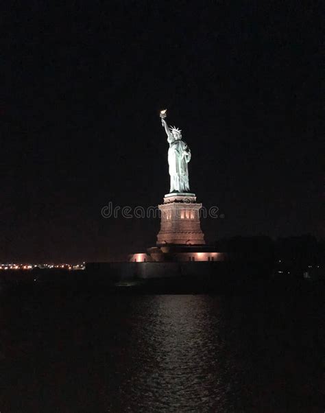 Night View Of The Illuminated Statue Of Liberty New York City Stock