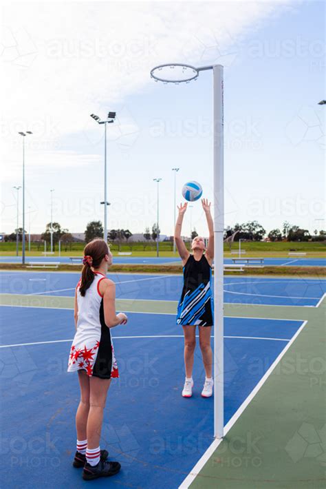 Image Of Teenaged Aboriginal Netball Player Shooting A Goal On The Court Austockphoto