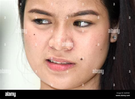 A Watchful Beautiful Filipina Female Woman Stock Photo Alamy