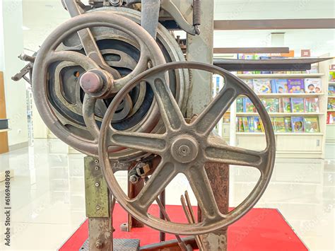 Parts Of Old Fashioned Book Binding Machine Made Of Iron Wheels And