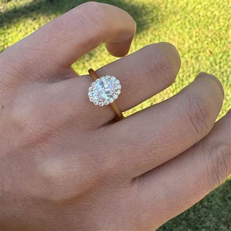 Oval Halo Diamond On A Plain Band Engagement Ring Temple And Grace Au