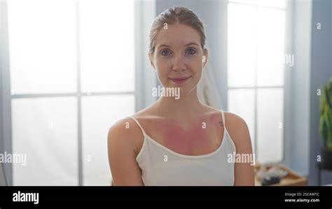 Young Blonde Woman At A Beauty Spa Center With A Sunburn On Her