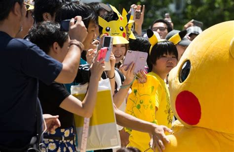 Photos Pokémon Go Craze Continues During Japans Pikachu Outbreak