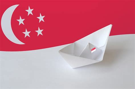 Premium Photo Close Up Of Paper Flag Against Red Background