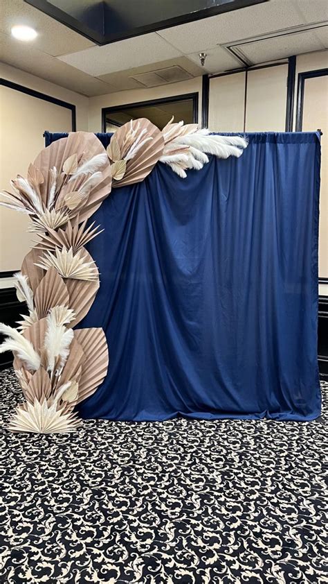 Classy Tiki Photo Backdrop With Paper Leaves And Pampas Grass