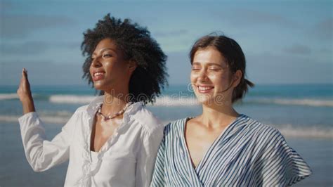 Two Girls Talking Sea Shore Closeup Carefree Lesbian Couple Walking
