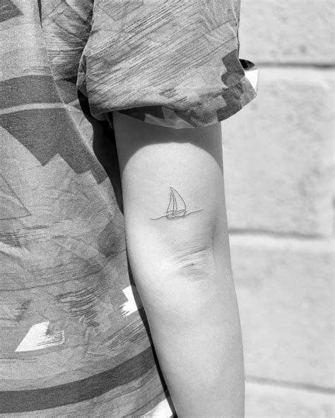 Minimalist Sailboat Tattoo On The Tricep Sailboat Tattoo Boat