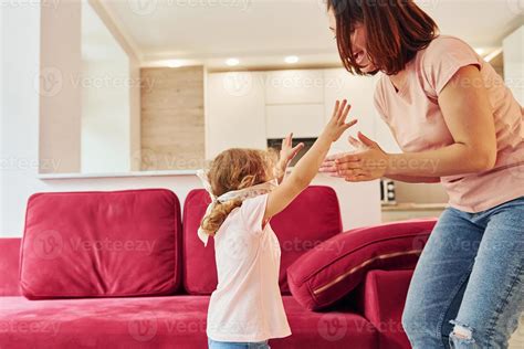 Playing Game With Eyes Blindfolded Young Mother With Her Little