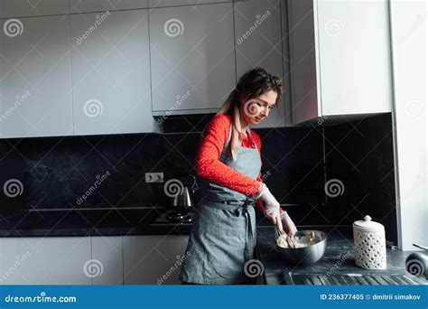 Woman Housewife Prepares Sweet Dessert Cake For Eating Stock Image