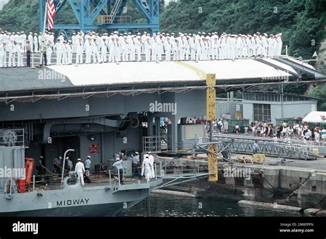 As The Aircraft Carrier Uss Midway Cv 41 Prepares To Depart Yokosuka