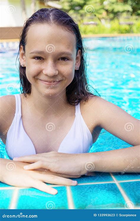 Cute Smiling Preteen Girl At Swimming Pool Edge Travel Vacation