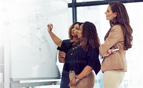 Collaborative Team Meeting With Whiteboard Discussions 77585357 Stock