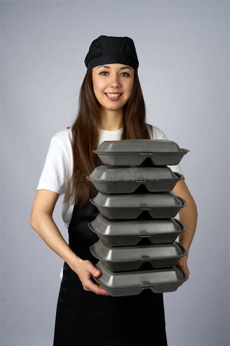 Young Woman Smiling Holding Polystyrene Takeaway Food Containers Stock