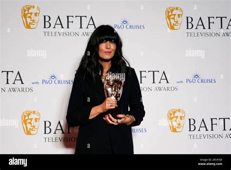 Claudia Winkleman Poses With Her Entertainment Performance Award For