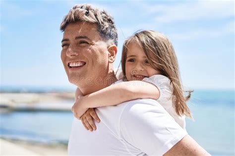 Father And Daughter Smiling Confident Hugging Each Other Holding On