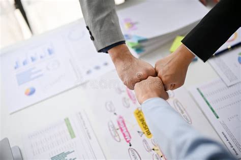 Top View Of Diverse Businesspeople Bumping Their Fists Together Over A Table Stock Image Image