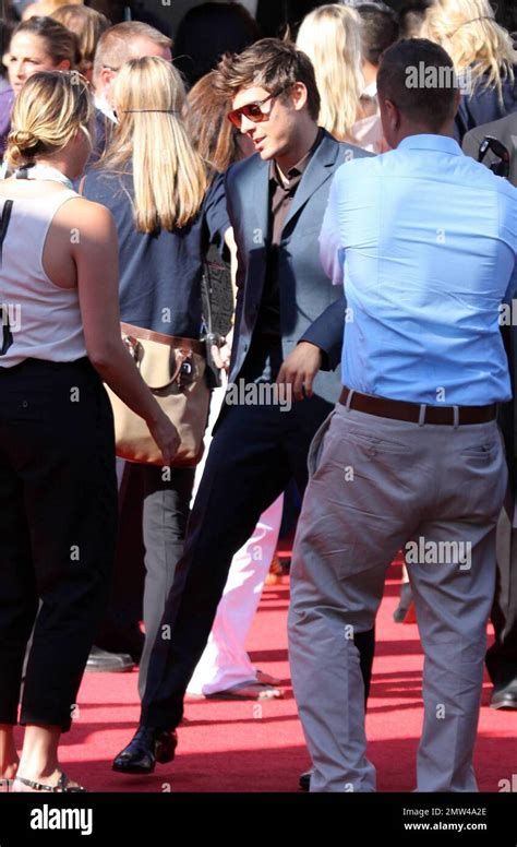 Actor Zac Efron Hugs A Female Friend Before He Heads Down The Red