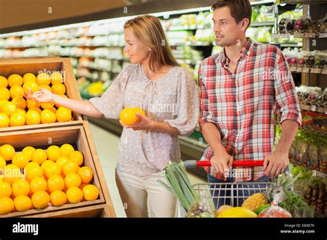 Couple Shopping Together In Grocery Store Stock Photo Alamy