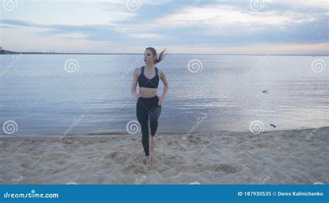Fitness Model Goes In For Sports On The Beach Does Abdominal Exercises