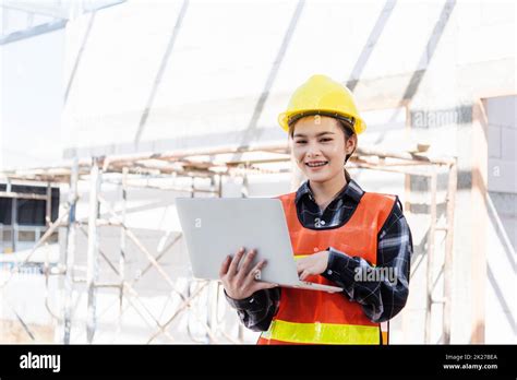 Asian Engineer Architect Worker Woman Holding Laptop Inspect And