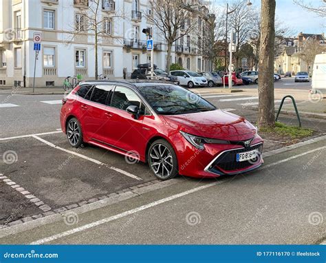 New Luxury Red Toyota Hybrid Electric Wagon Car Parked Editorial Image