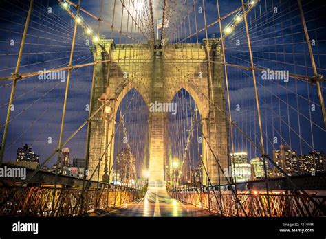 View Of Historic Brooklyn Bridge At Night Seen From The Pedestrian