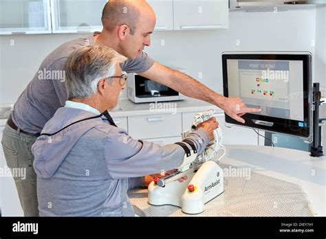 patient with assistive robot for upper limb rehabilitation the robot