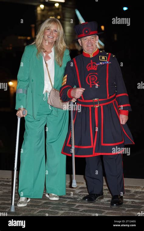 Penny Lancaster With A Yeoman Warder As She Attends The Launch Of Geri